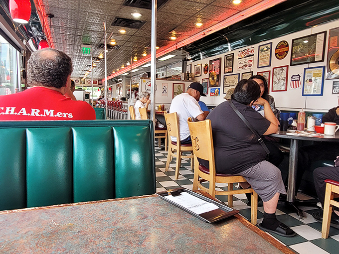 The diner hums with conversation and clinking silverware, where regulars and road-trippers share the universal language of "pass the ketchup, please."