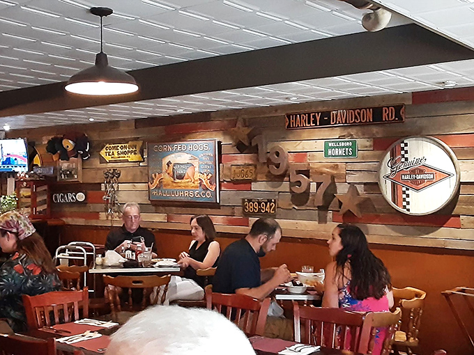 The dining room where strangers become temporary neighbors, united by the universal language of "pass the steak sauce, please."