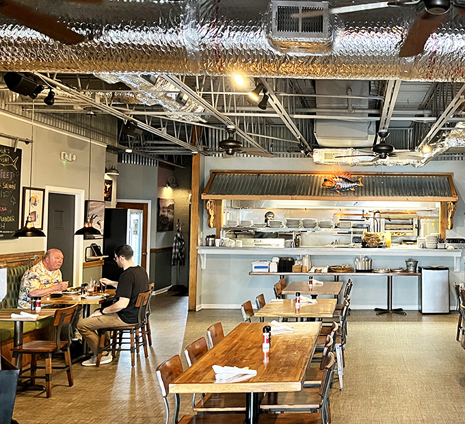 The open kitchen layout lets you witness culinary choreography in action. Nothing builds appetite quite like watching professionals at work.