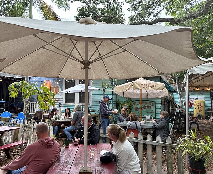 The backyard seating area feels like you've crashed the coolest neighborhood cookout in Florida. Everyone's welcome at this party.