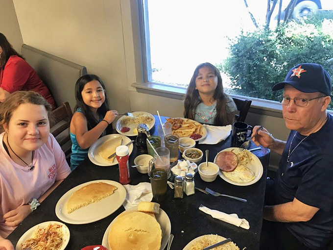 Multi-generational dining is the norm here. From grandpa's Astros cap to the kids' eager faces, Blue Bonnet creates memories that outlast the meal itself.