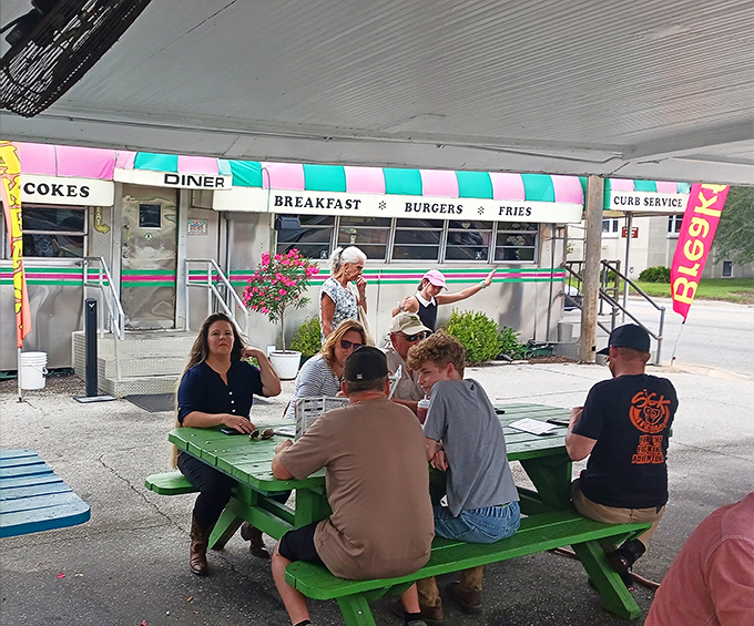 Outdoor picnic tables where strangers become friends over shared appreciation for food that actually tastes like something worth remembering.