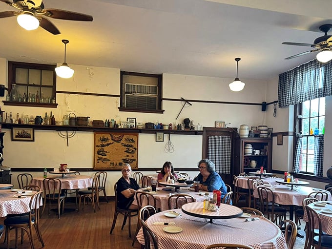 The dining room buzzes with conversation as patrons enjoy a meal surrounded by history &ndash; these walls have gone from hearing spelling bees to "pass the gravy, please."