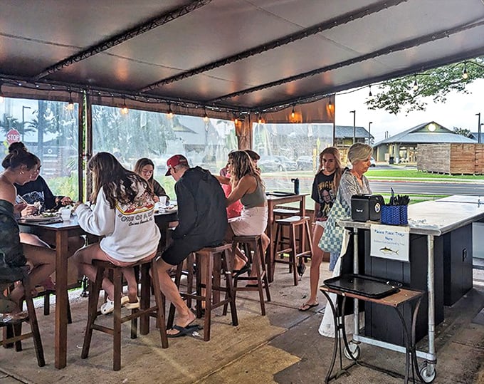 The covered patio fills with a symphony of satisfied murmurs and the occasional "You gotta try this!" exclamation.