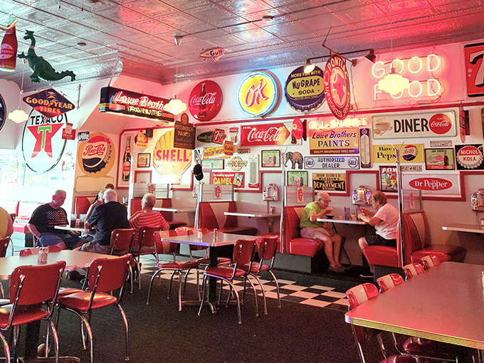 The walls tell as many stories as the diners themselves, with vintage signs illuminating conversations that have spanned generations.