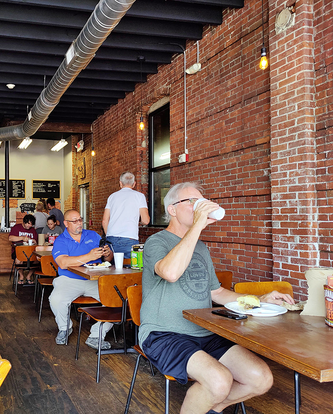 The dining room becomes a temporary community of strangers united by the universal language of "mmm" and "have you tried the brisket yet?"