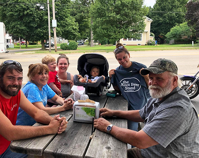 Multi-generational magic happens at these picnic tables, where root beer brings families together better than any family therapist ever could.