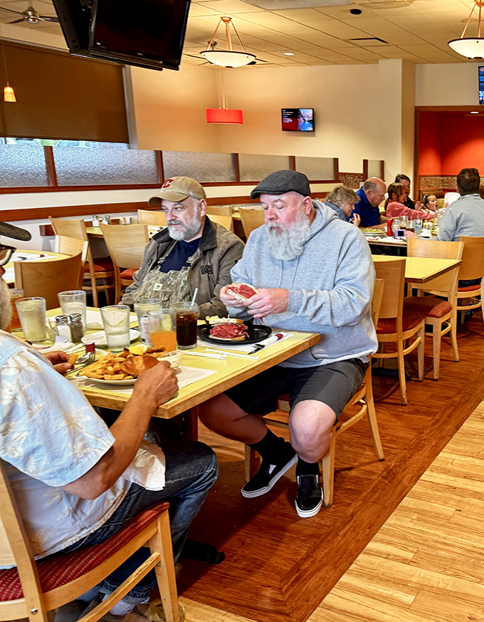 Real people enjoying real food without phones in sight. This isn't just dining—it's that increasingly rare phenomenon known as actual human connection.