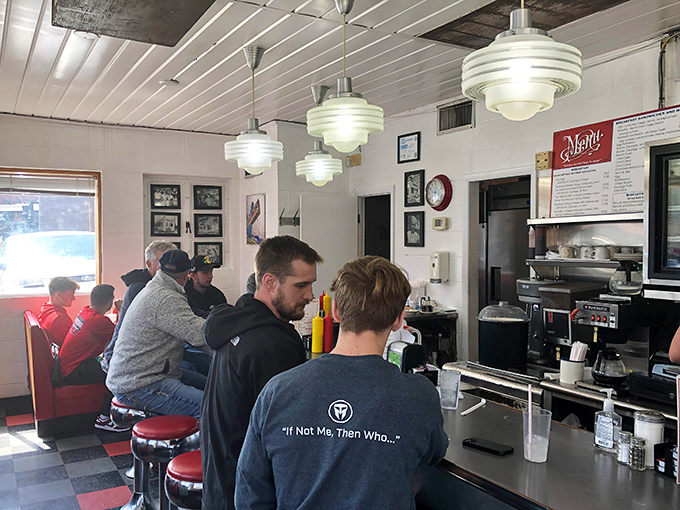 The counter seating isn't just functional&mdash;it's communal, turning strangers into neighbors united by the universal language of "pass the ketchup, please."