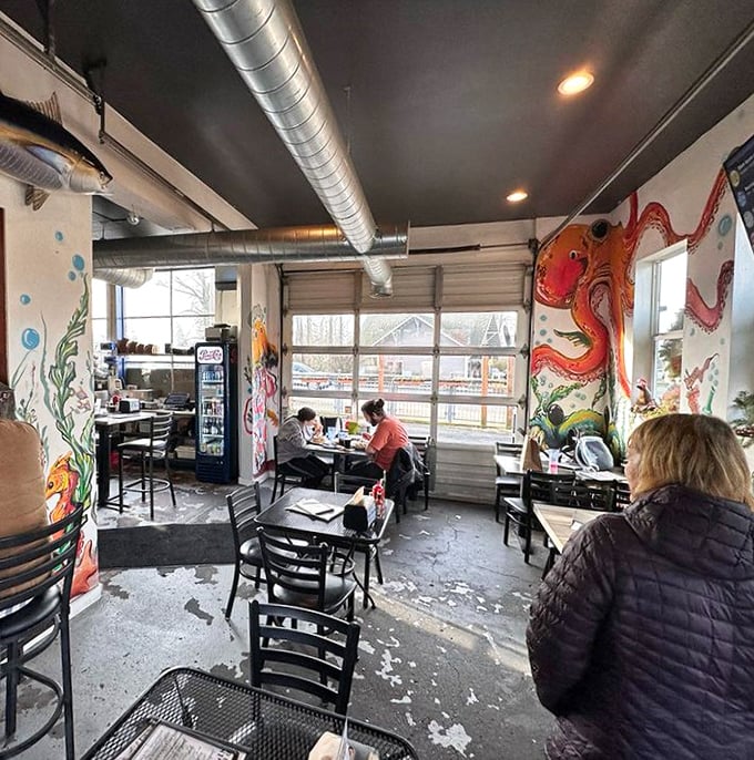 The industrial-chic interior with vibrant sea murals makes every meal feel like an underwater expedition. Minus the wetsuit.
