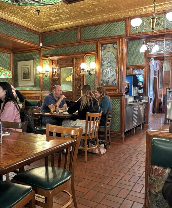 The dining room hums with the universal language of satisfied customers &ndash; forks meeting plates in a symphony of breakfast contentment.