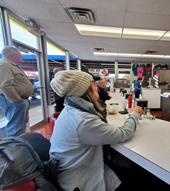 Fellow pilgrims gathering at the altar of oversized burgers, united in their quest for satisfaction.