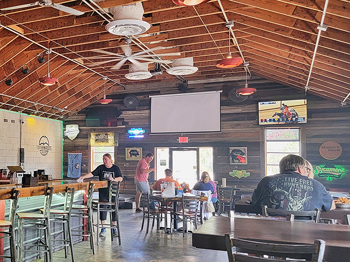 The universal language of barbecue brings folks together under wooden rafters. Notice how nobody's looking at their phones&mdash;the food demands full attention.