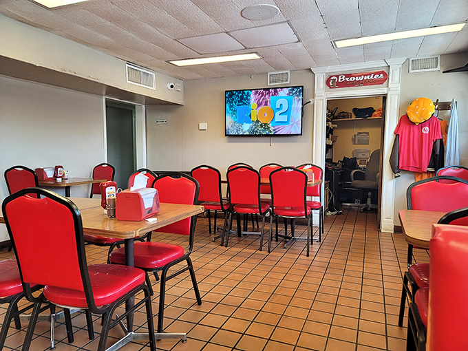 Red chairs against terra cotta tiles&mdash;Brownie's dining room isn't trying to be Instagram-famous. It's too busy being authentically, unapologetically itself.