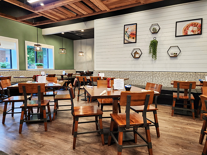 Modern rustic charm with wooden accents and hexagonal wall art creates a space where you'll want to linger long after your plate is clean.