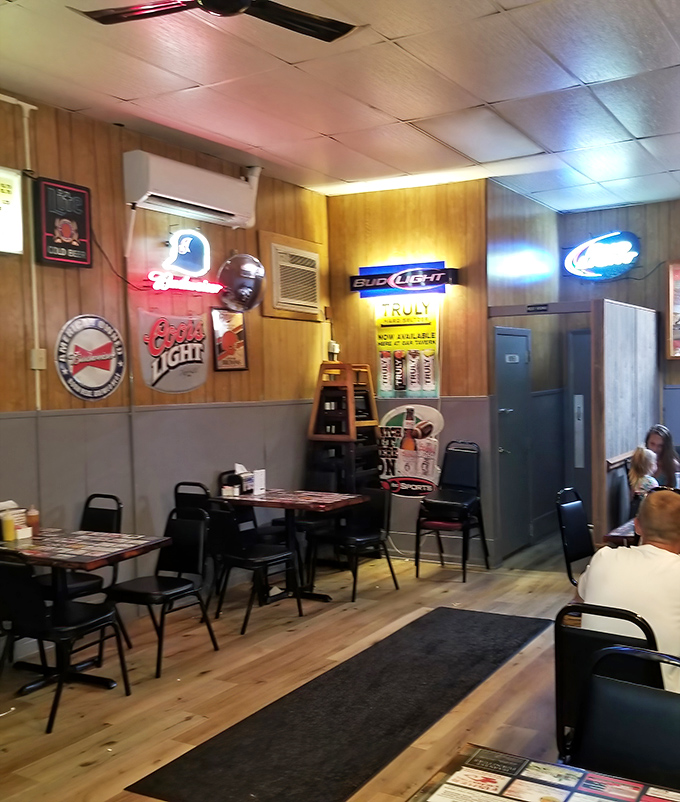 Beer signs glow like beacons of hospitality in this no-frills dining area where comfort trumps pretension every time.