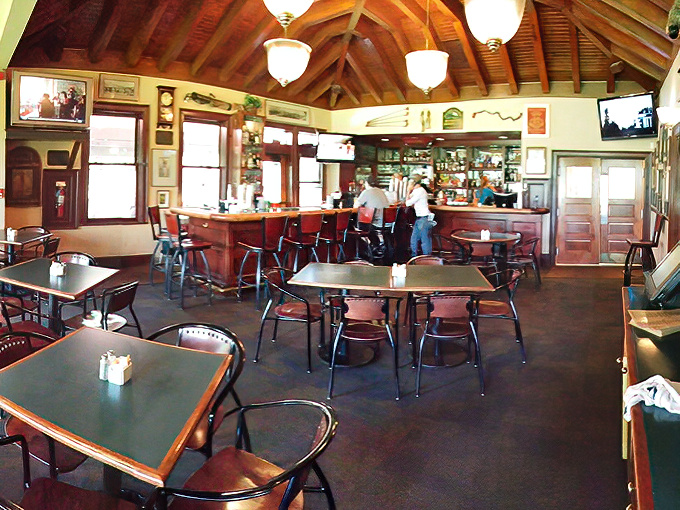 The bar area buzzes with the happy hum of people who've discovered that golf stories improve dramatically with good drinks.
