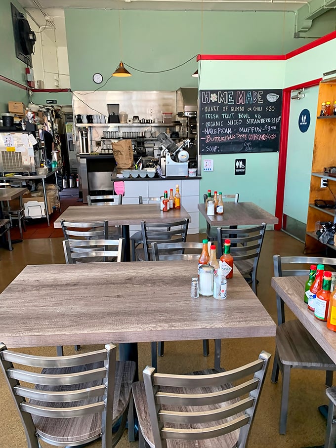 Mint-green walls and metal chairs create that perfect blend of retro charm and practical comfort where lingering over breakfast feels like a birthright.