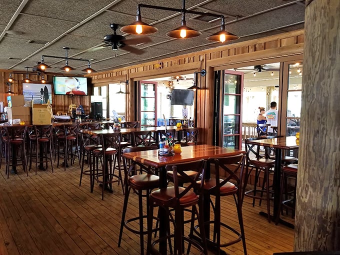 The dining area's wooden charm feels like you've been invited into a ship captain's personal quarters – if that captain had excellent taste in lighting.