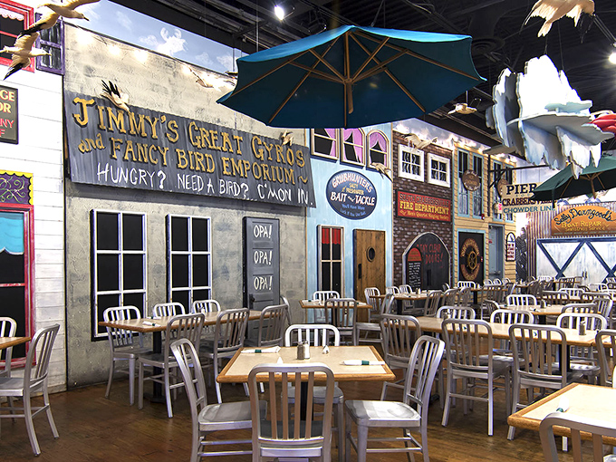 The dining area's whimsical storefronts create a boardwalk atmosphere. It's like eating in a coastal town square, minus the seagulls eyeing your plate.