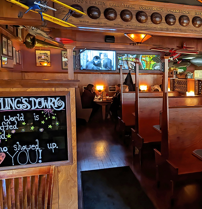 Vintage sports memorabilia and warm lighting create the perfect backdrop for the serious business of burger enjoyment.