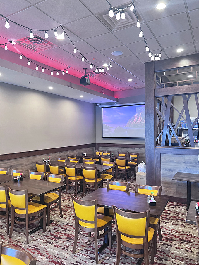 Yellow chairs brighten the dining area like sunshine, while string lights add a touch of magic to conversations and second helpings.
