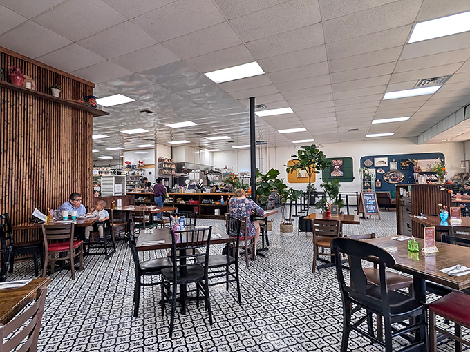 The dining area balances modern and cozy, with patterned floors and wooden accents creating a space where lingering isn't just allowed&mdash;it's encouraged.