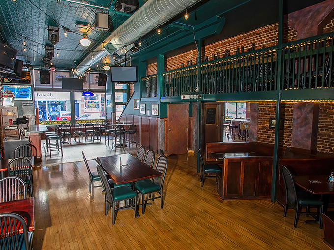 The dining area balances sports bar energy with comfortable seating, where wooden tables and that gorgeous tin ceiling create an atmosphere worth savoring.