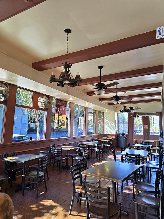 Sunlight streams through windows onto terra cotta floors. This dining room has hosted first dates, family celebrations, and post-concert feasts.