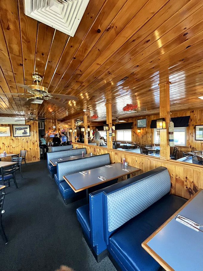 Classic blue booth seating and knotty pine walls &ndash; the quintessential Maine seafood joint where memories are made between bites.