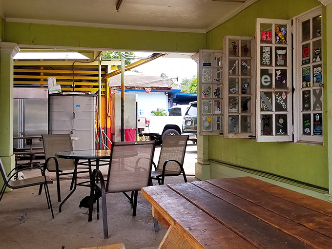 The lime-green walls and wooden tables create the perfect backdrop for the seafood drama about to unfold.