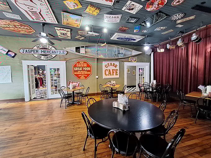 The dining area feels like a museum of local memories, where every vintage sign and photograph adds another layer to your meal's backstory.