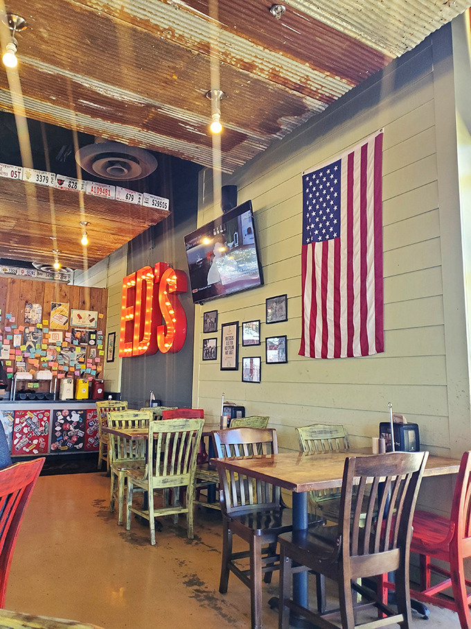 The interior showcases rustic charm with its illuminated "ED'S" sign, American flag, and wooden ceiling &ndash; patriotism meets comfort food at its finest.