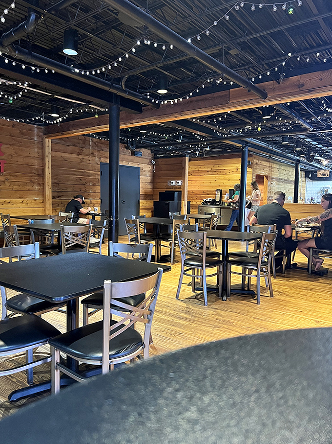 String lights overhead create the perfect ambiance for serious barbecue business. Even the ceiling knows this is a special occasion.