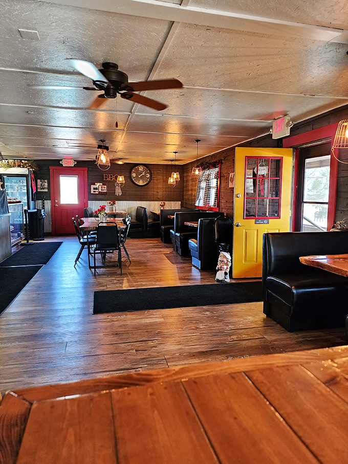 The bright yellow door adds a pop of sunshine to the rustic interior where leather booths invite you to settle in for serious eating. 