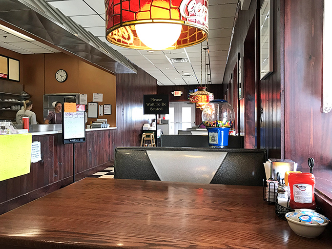 The dining area doesn't need fancy lighting or designer chairs. It's too busy serving up memories alongside meatloaf specials.