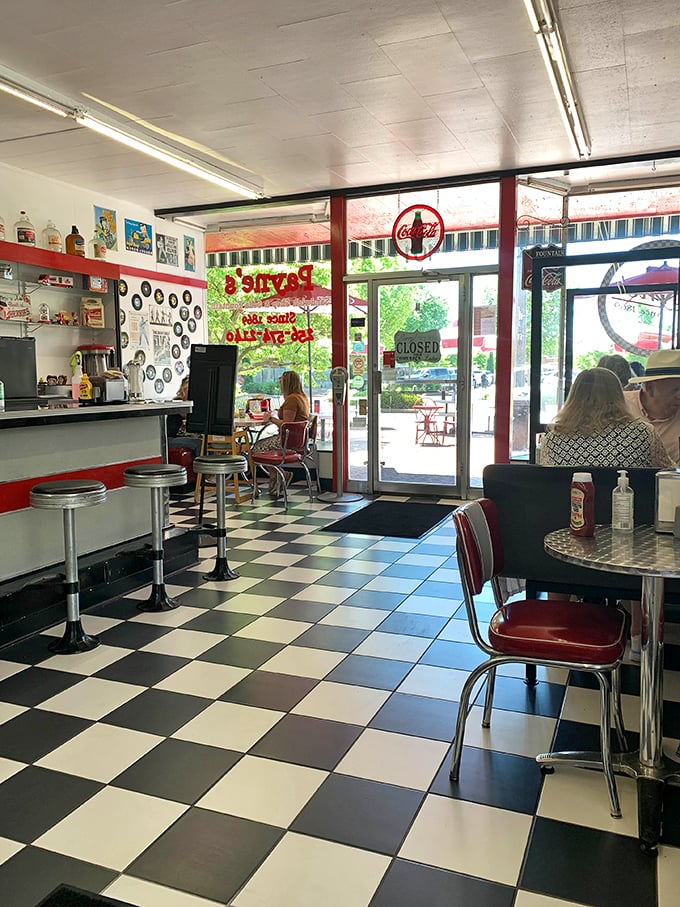 The dining area serves nostalgia alongside sandwiches, with every red chair and vintage sign telling stories of countless conversations and first dates.