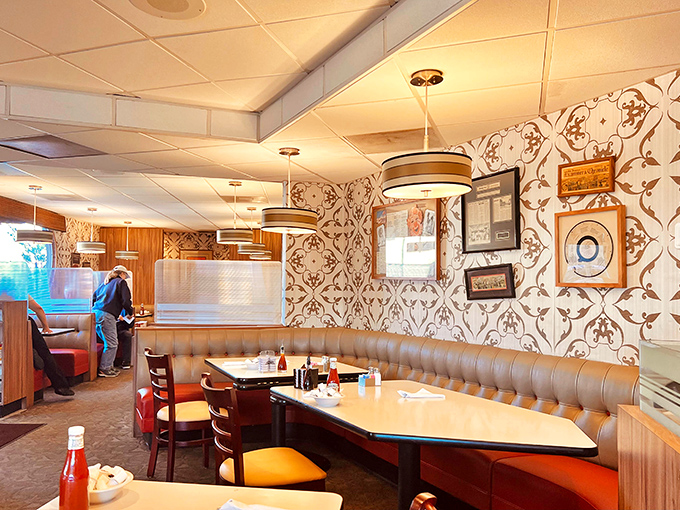 Curved booths designed for lingering conversations and the occasional "just one more bite" of pie. Wallpaper that's seen decades of celebrations.