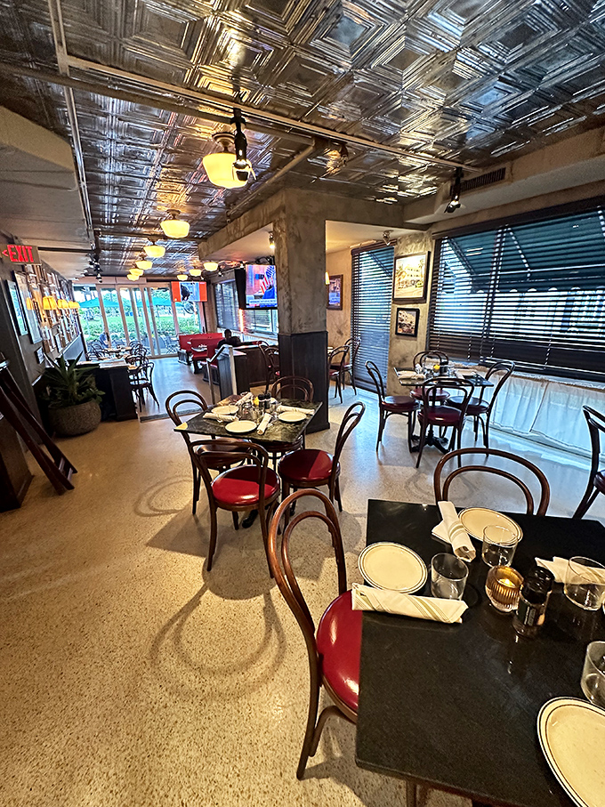 The dining room's pressed tin ceiling and warm lighting create the perfect backdrop for both first dates and "we've been married 40 years" celebrations.