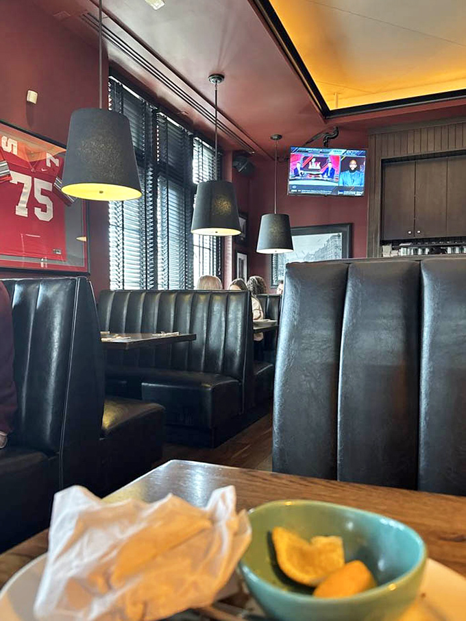 Leather booths that invite you to settle in for the long haul, under lighting that flatters both you and your food.