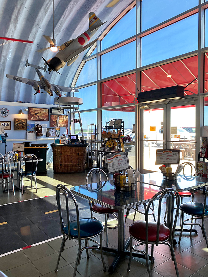 Sunshine streams through floor-to-ceiling windows, illuminating model planes and creating the perfect backdrop for morning coffee and conversation.