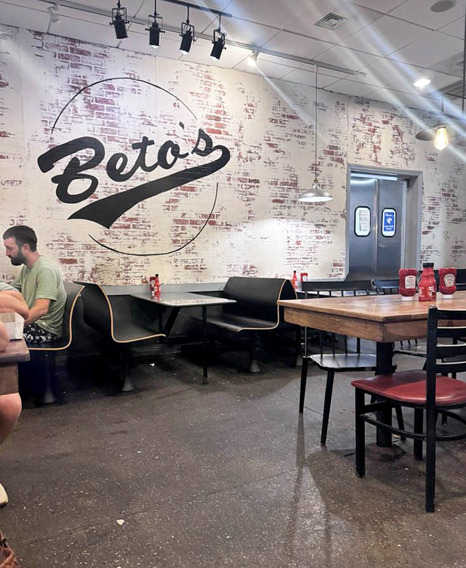 The dining room feels like Pittsburgh itself&mdash;unpretentious, genuine, with character etched into every brick. That Beto's logo watches over diners like a benevolent pizza deity.