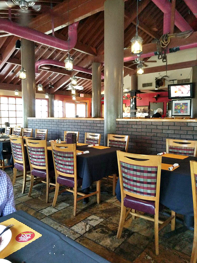 Exposed beams, pendant lighting, and comfortable seating create the perfect backdrop for the serious business of enjoying Brazilian barbecue without distraction.