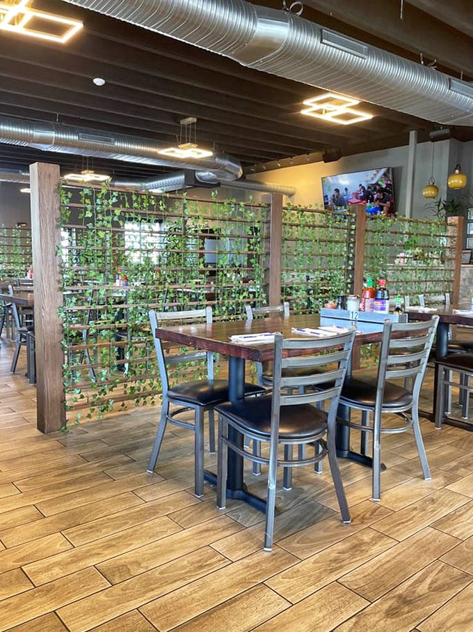 The clever green lattice dividers create intimate dining spaces while still letting you eavesdrop on what everyone else ordered. Strategic seating at its finest.