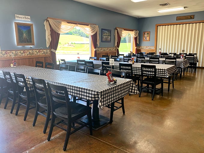 Black and white checkered tablecloths against blue walls&mdash;the dining room equivalent of a warm hug from someone who knows how to cook.