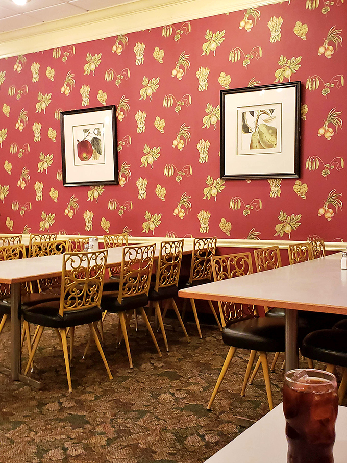 That fruit-patterned wallpaper has watched over countless meals, each one a small celebration of good eating.