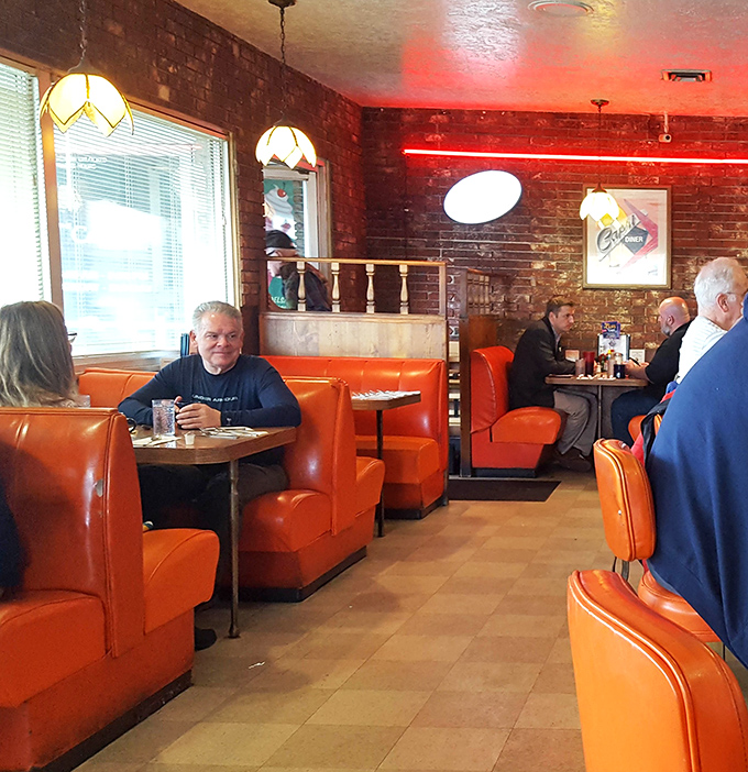 The dining room hums with the energy of regulars and first-timers sharing the same thought: "This is exactly what a diner should feel like."