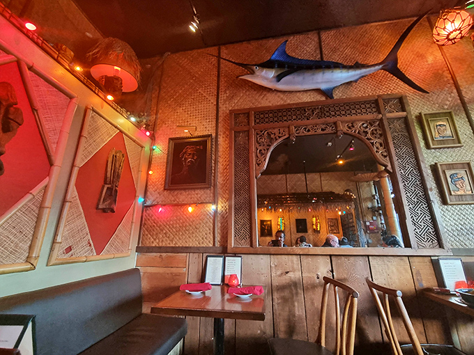 The dining area feels like you've stumbled into the coolest beach bar in Hawaii—complete with fishing nets and that marlin who's seen it all.