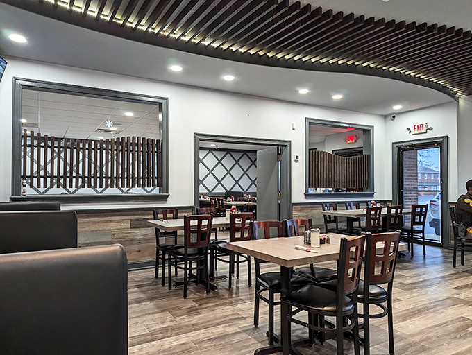 Modern meets classic in this thoughtfully designed dining space. Those wooden ceiling elements add warmth without the kitsch.