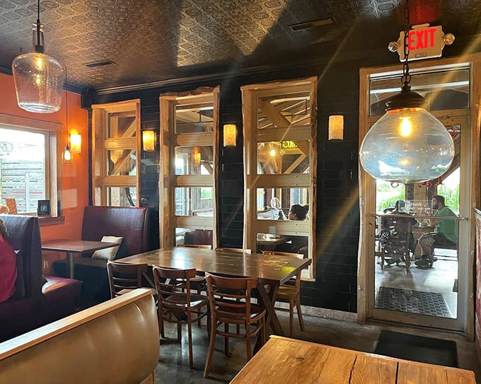 Dark walls and wooden accents create a dining space that feels both intimate and social&mdash;like the best corner of your favorite neighborhood pub.